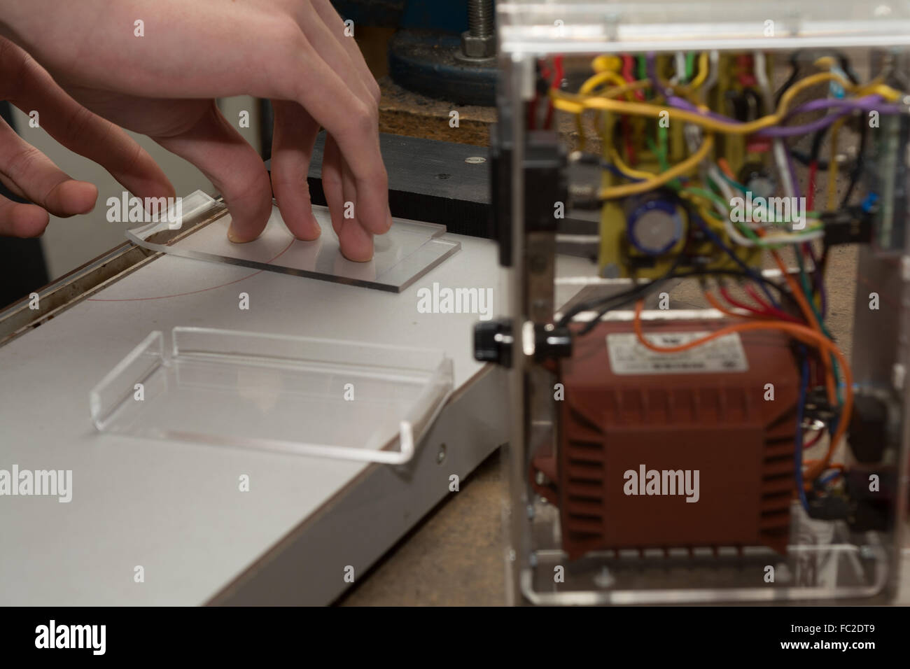 Technician works with acrylic glass Stock Photo - Alamy