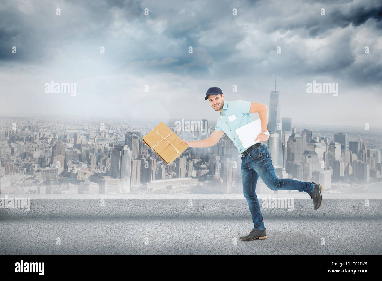 Composite image of happy delivery man running with package Stock Photo ...