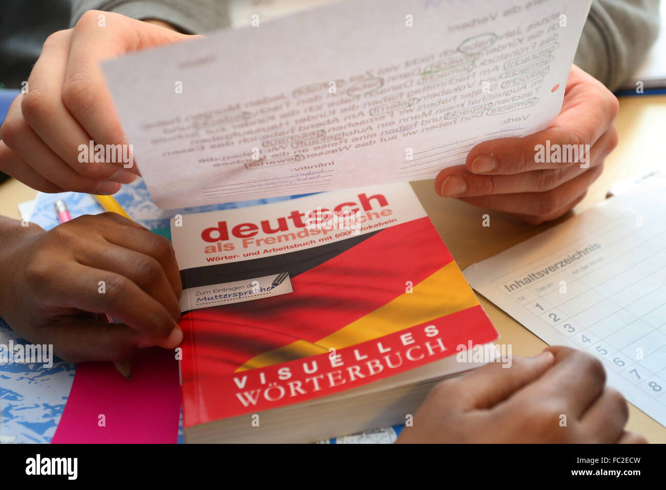 Tutor Alexander Huebner helps 14-year-old unaccompanied refugee Samuel ...