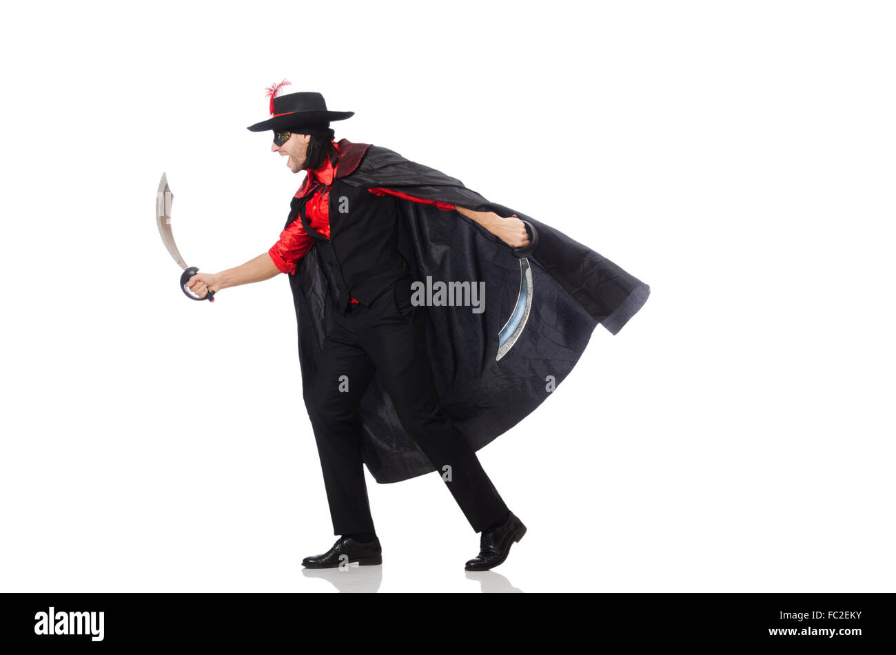 Young man in carnival coat with sword isolated on white Stock Photo - Alamy