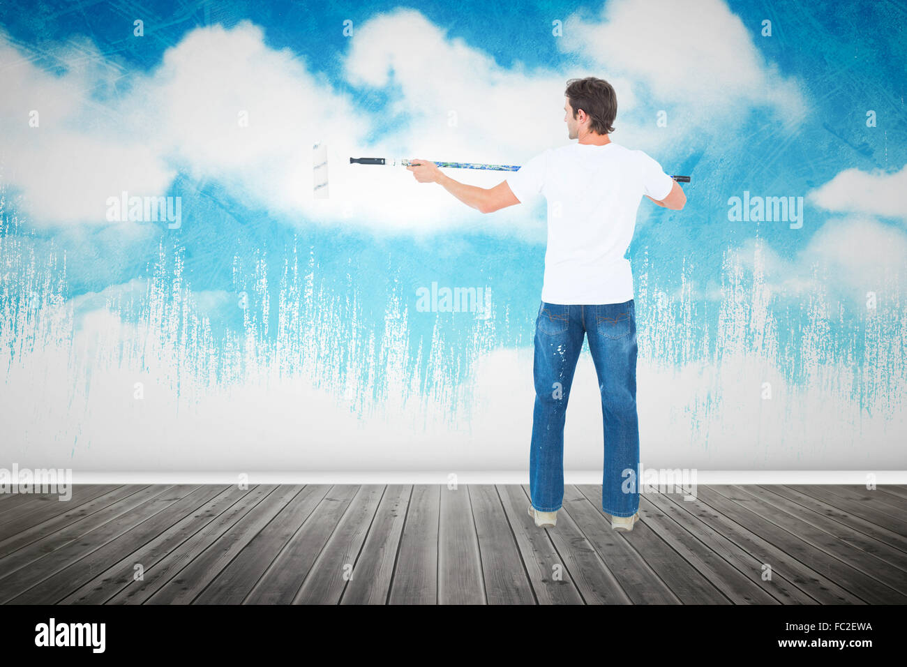 Composite image of man using paint roller on white background Stock ...
