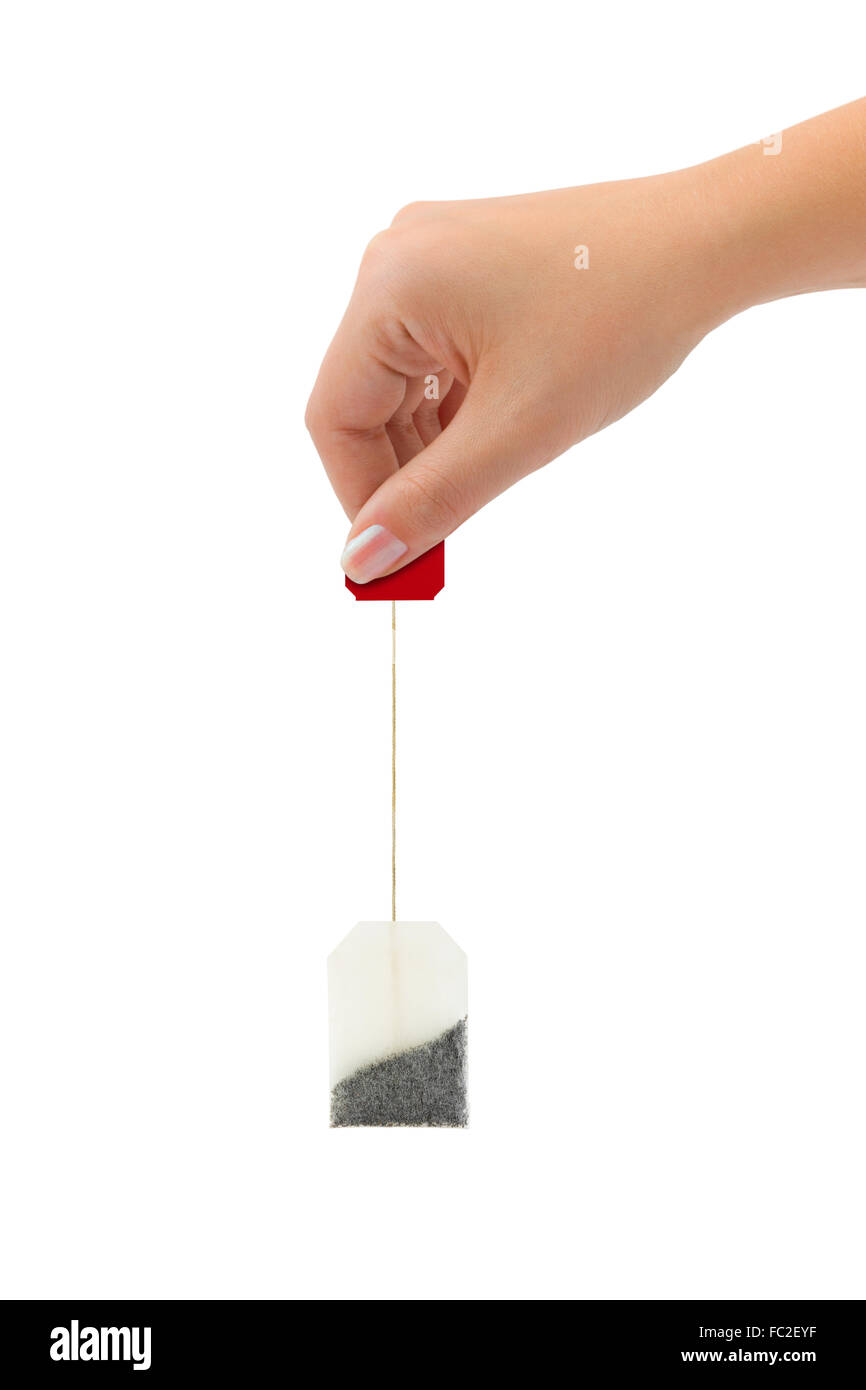 Hand and tea bag Stock Photo - Alamy