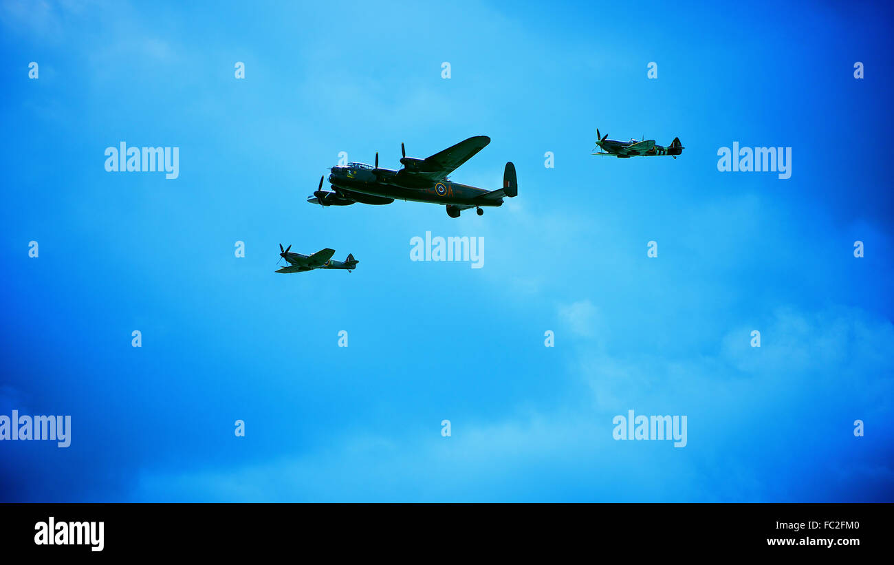 Avro Lancaster Bomber flying with Spitfire and Hurricane against a ...