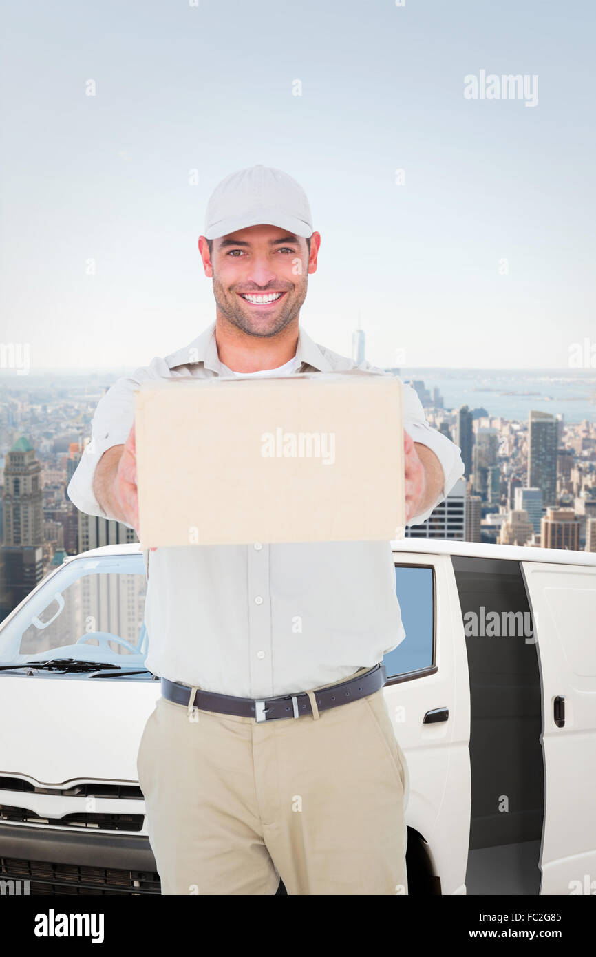 Composite image of portrait of happy delivery man giving package Stock ...