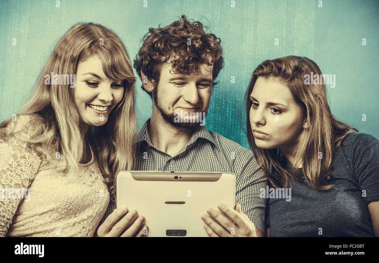 Friends browsing surfing internet on tablet. Young people man guy and ...