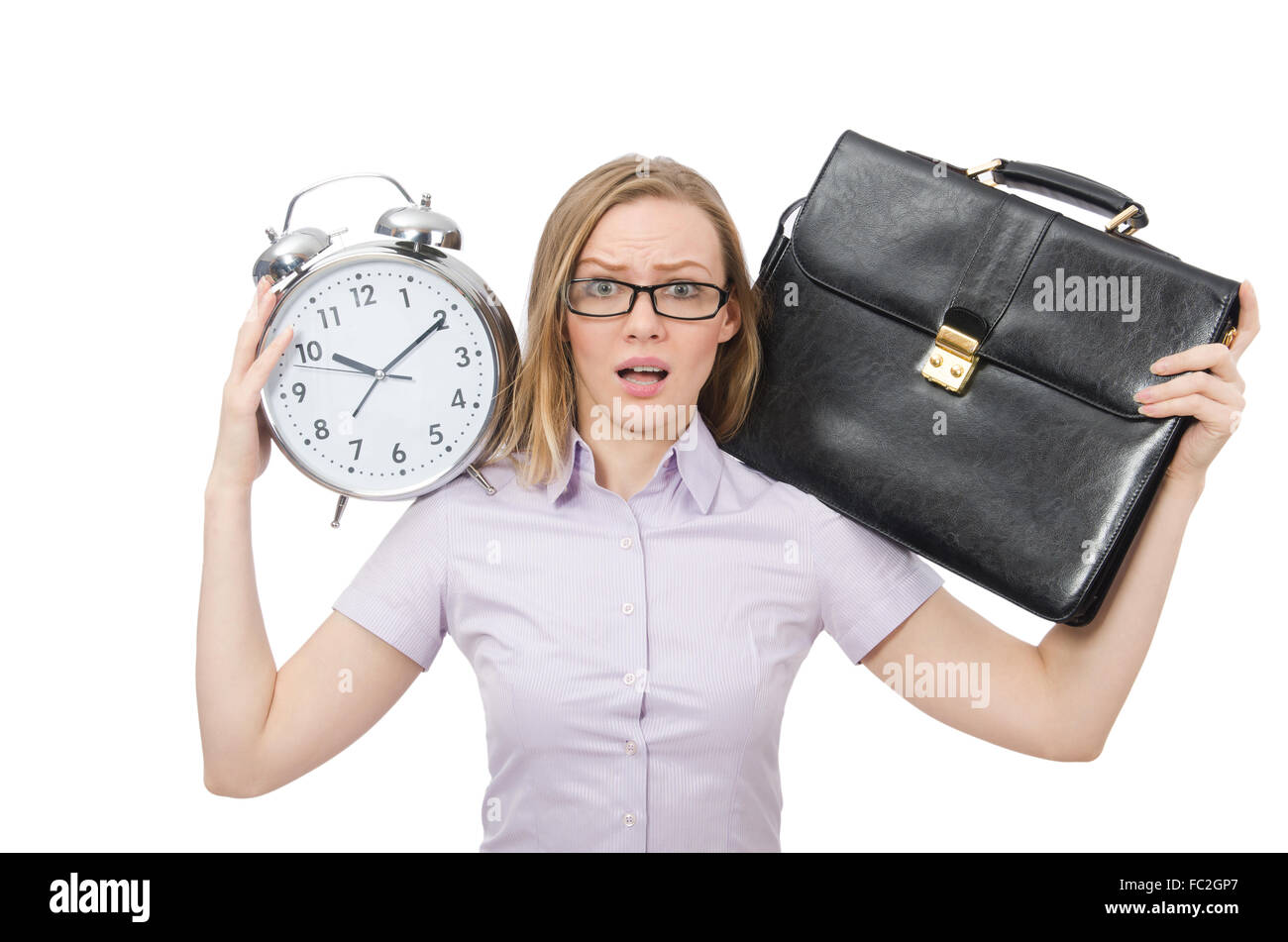 Young employee holding alarm clock isolated on white Stock Photo - Alamy