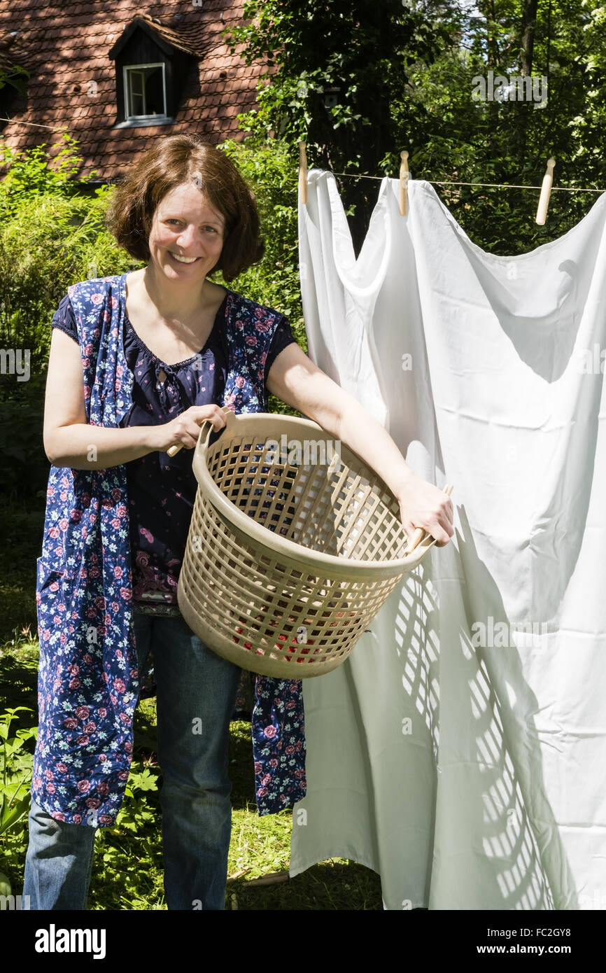 Hanging up clothes hi-res stock photography and images - Alamy