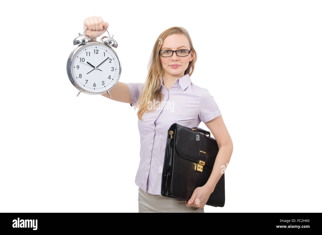 Young employee holding alarm clock isolated on white Stock Photo - Alamy