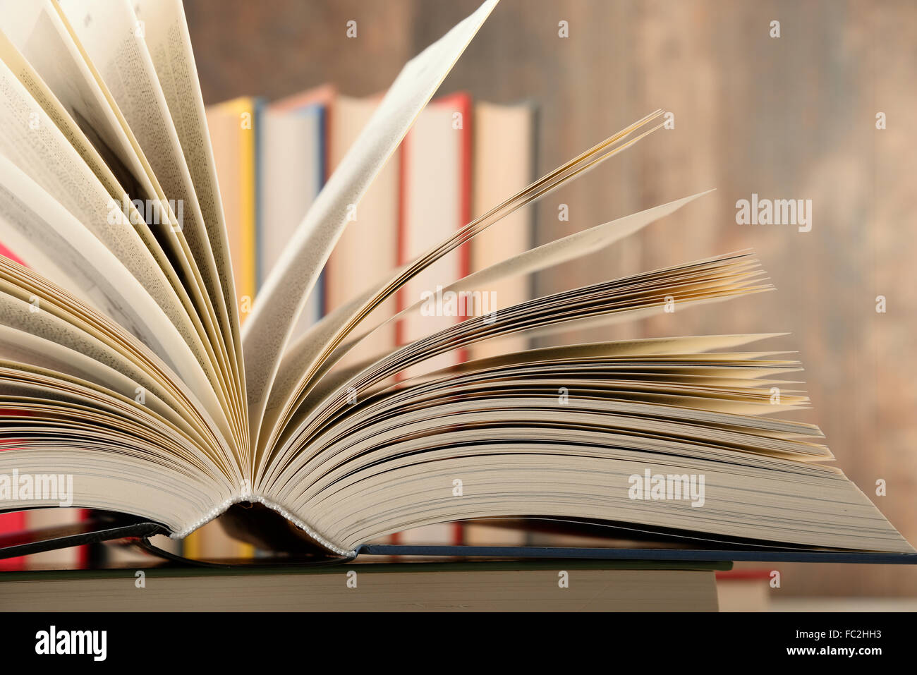 Composition with hardcover book in the library Stock Photo - Alamy