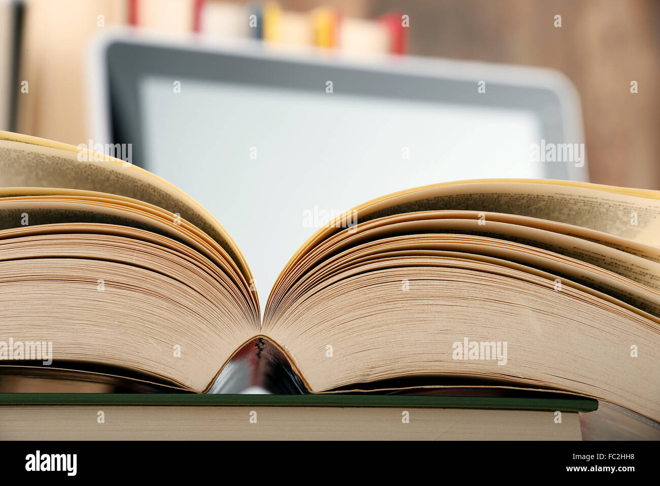 Composition with books and tablet computer on the table Stock Photo - Alamy