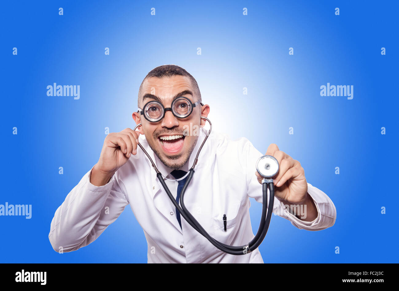Funny doctor isolated on the white Stock Photo - Alamy
