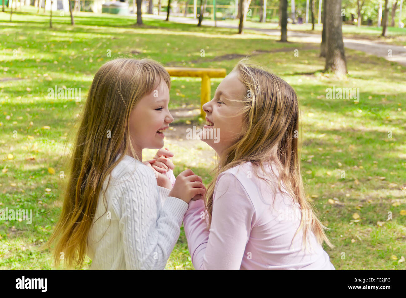 Cute two playing girls Stock Photo - Alamy