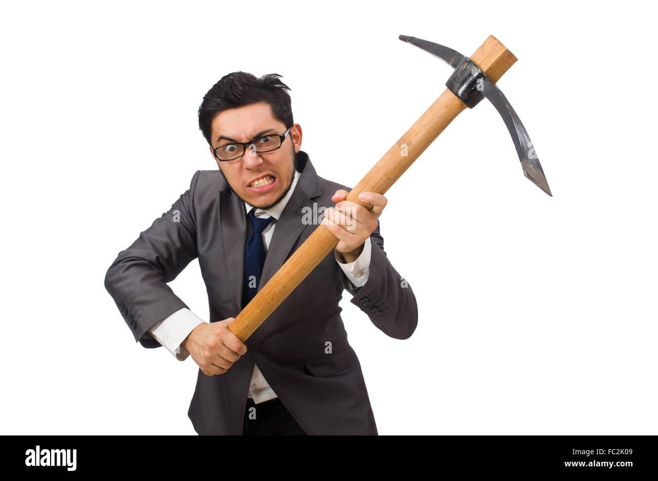 Young businessman holding a tool isolated on white Stock Photo - Alamy