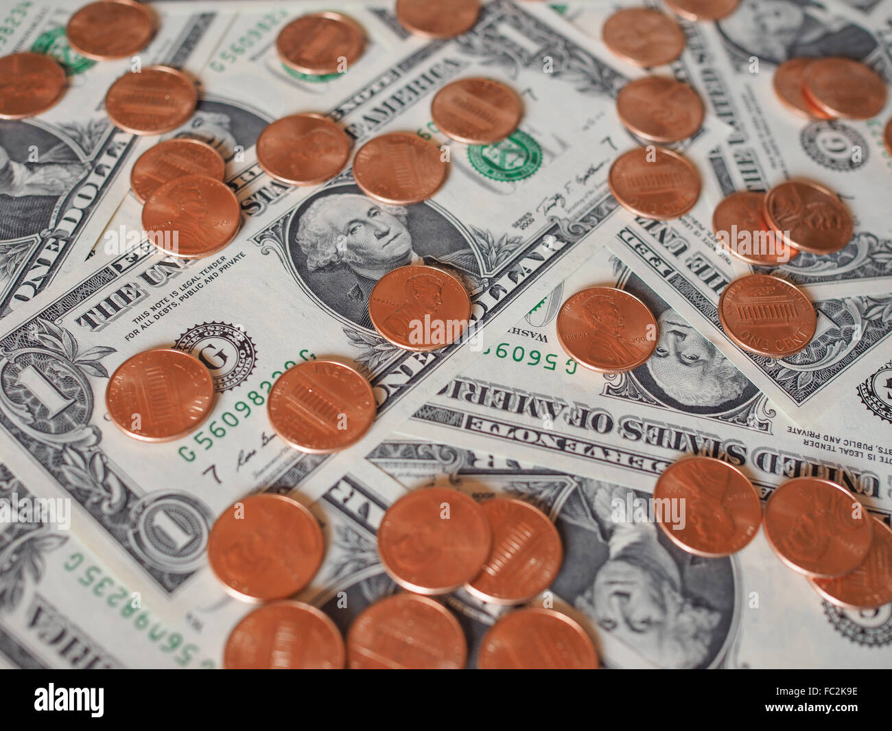 Dollar coins and notes Stock Photo - Alamy