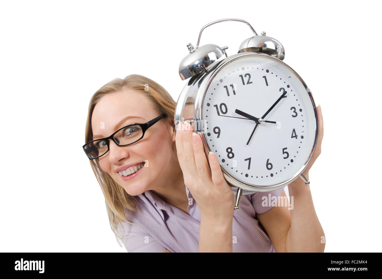 Young employee holding alarm clock isolated on white Stock Photo - Alamy