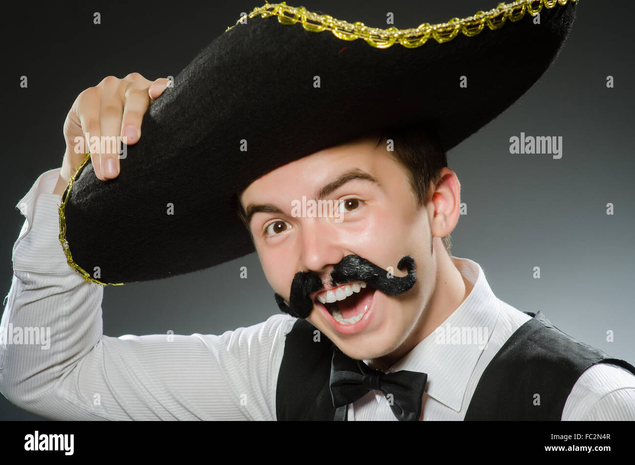 Smiling mexican with sombrero isolated on white Stock Photo - Alamy