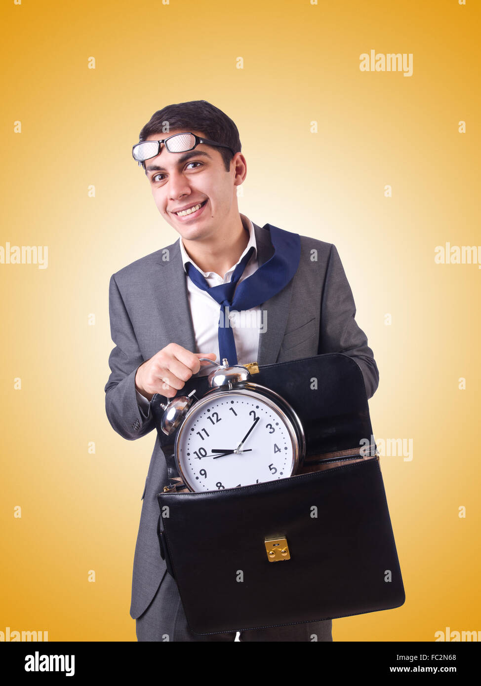Businessman with clock isolated on white Stock Photo - Alamy