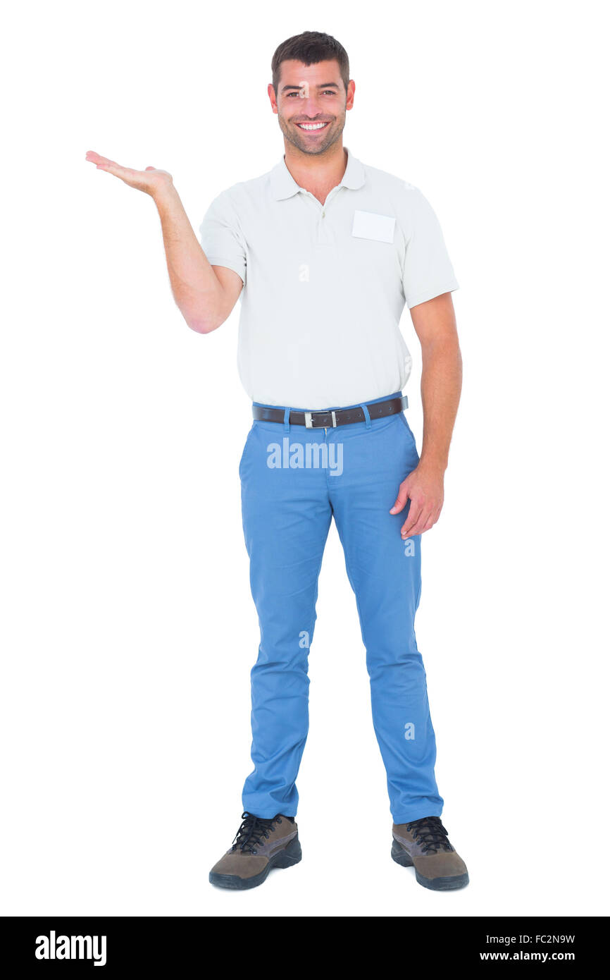 Salesman presenting in his palm against white background Stock Photo ...