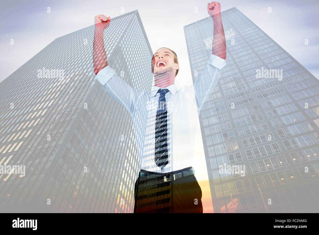 Composite image of handsome businessman cheering with arms up Stock ...