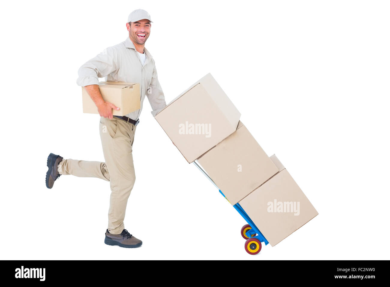 Happy delivery man with trolley of boxes running on white background ...