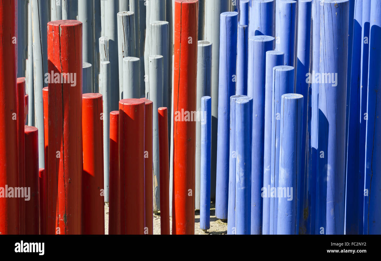 red, gray and blue painted wooden rods Stock Photo - Alamy