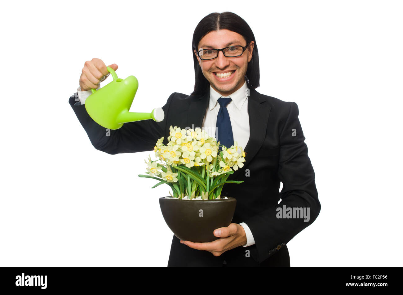 Handsome businessman holding spring flowers isolated on white Stock ...