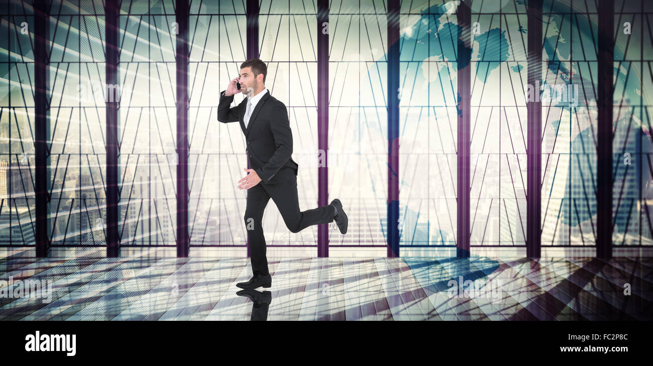 Composite image of businessman running on the phone Stock Photo - Alamy