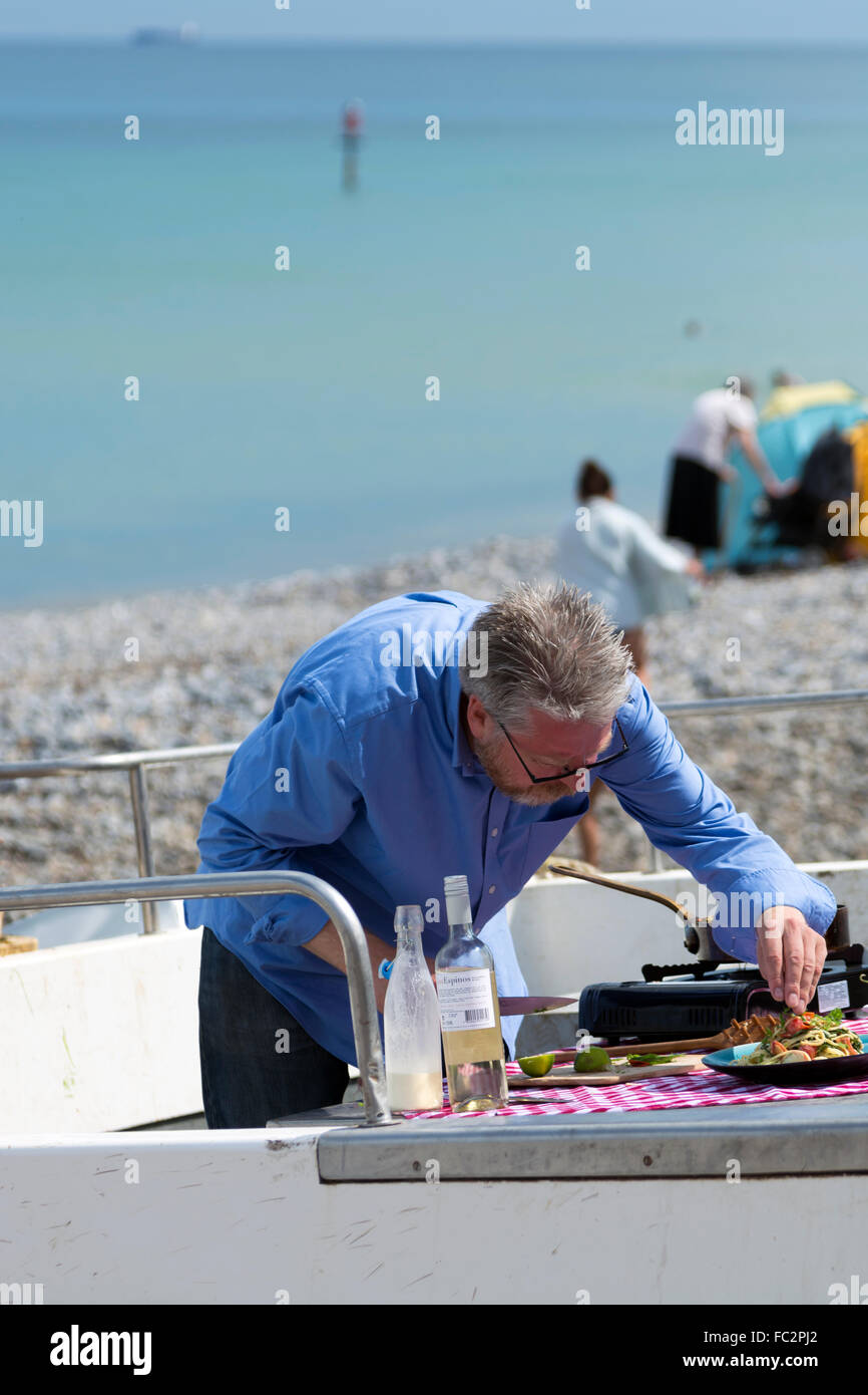 Man cooking dish hi-res stock photography and images - Alamy