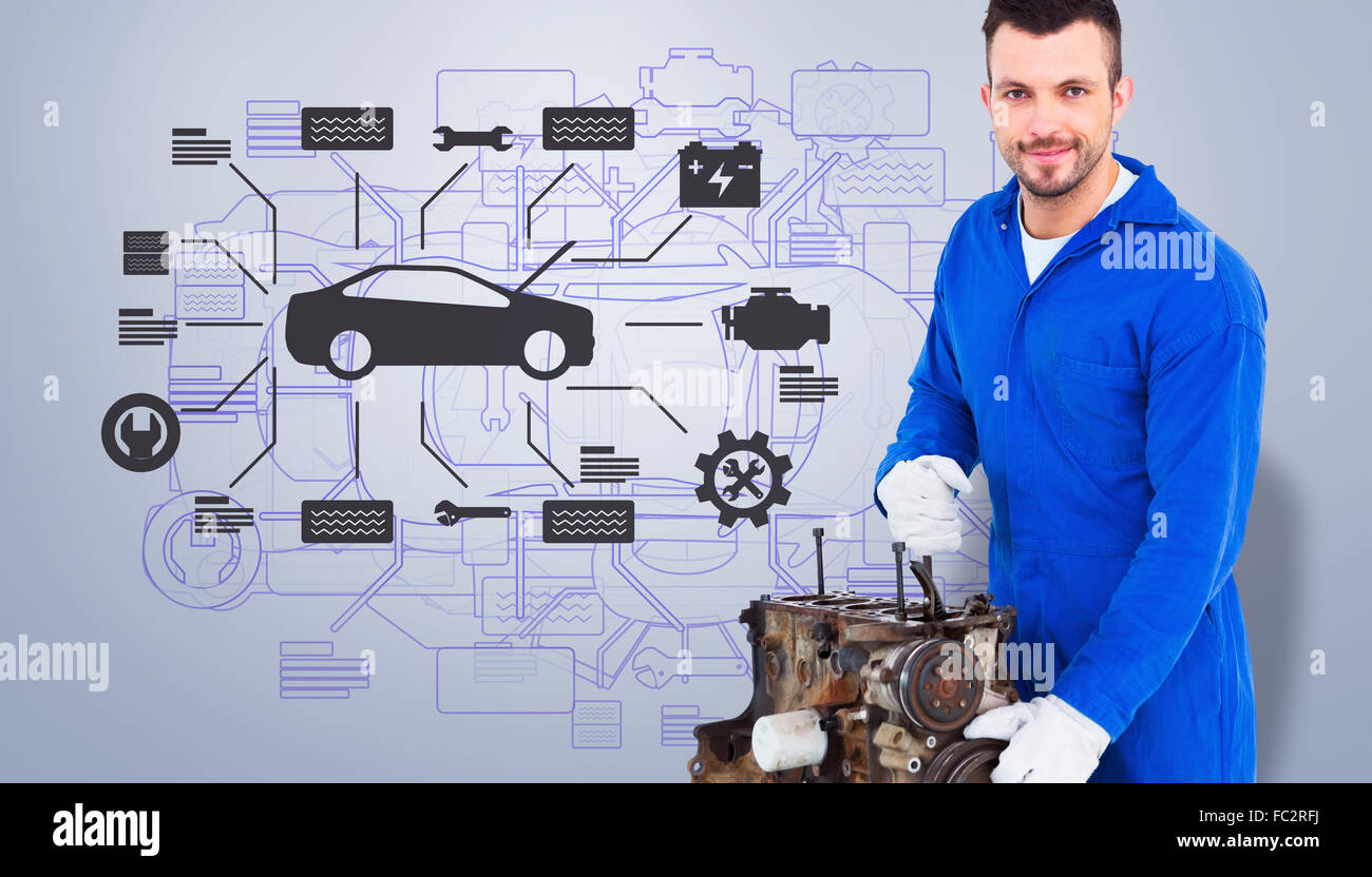 Composite image of smiling male mechanic repairing car engine Stock ...