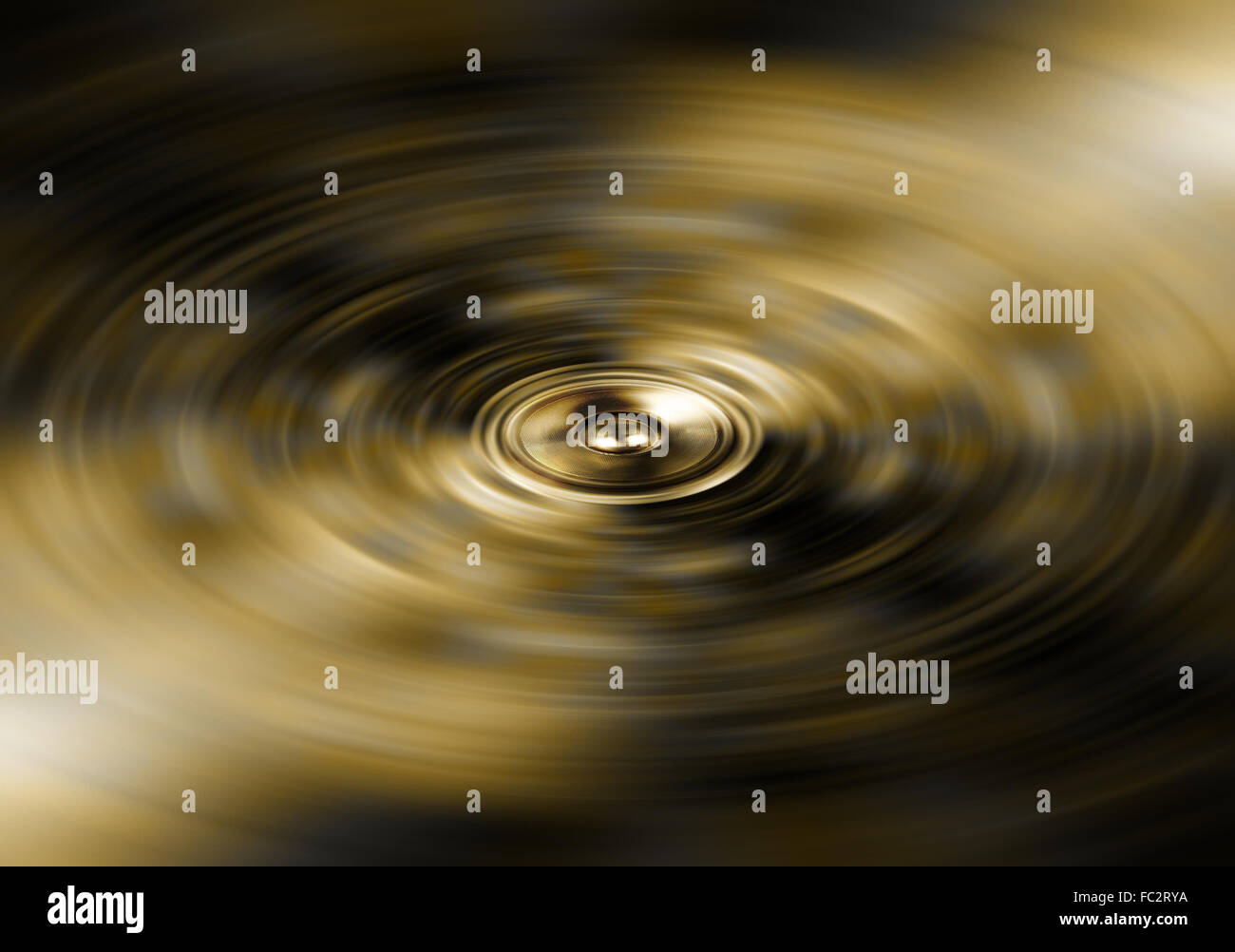 Spinning gold speaker Stock Photo - Alamy