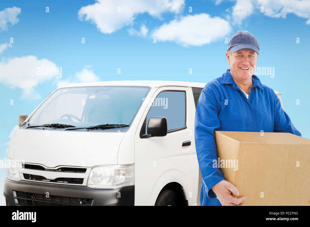 Composite image of happy delivery man holding cardboard box Stock Photo ...