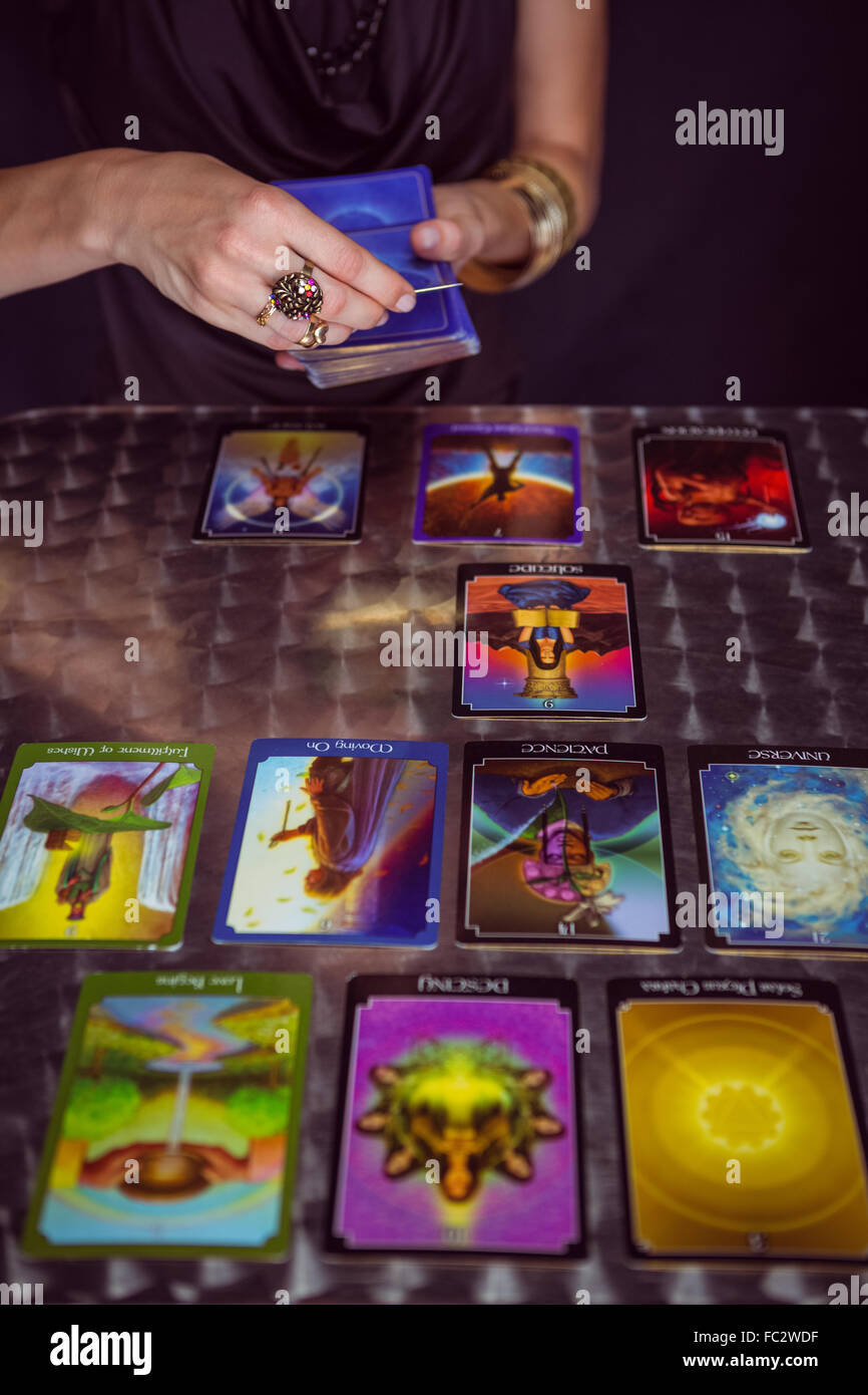 Fortune teller forecasting the future with tarot cards Stock Photo - Alamy