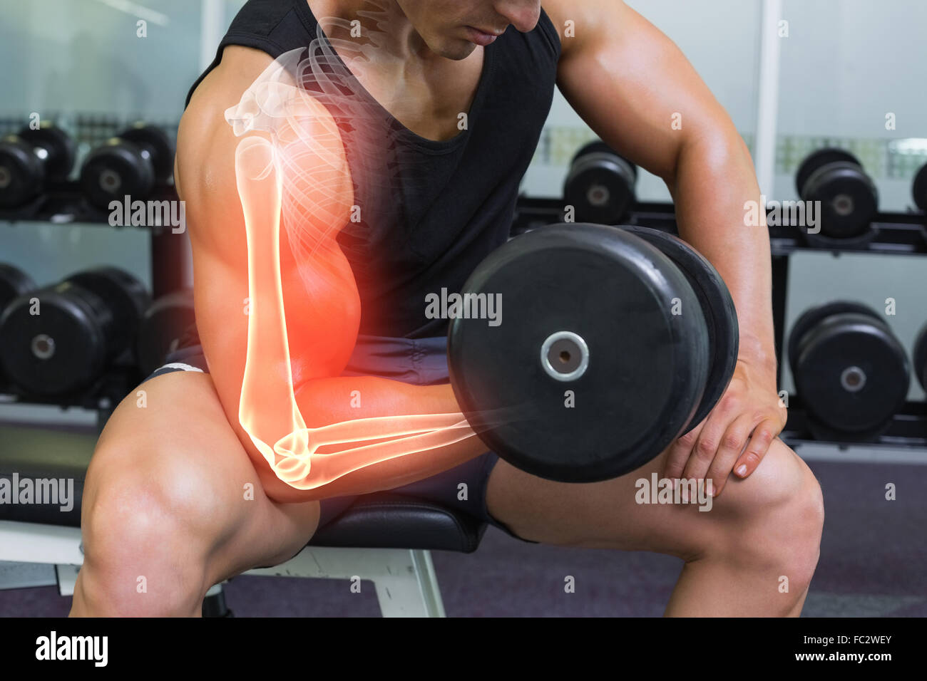Highlighted arm of strong man lifting weights Stock Photo - Alamy