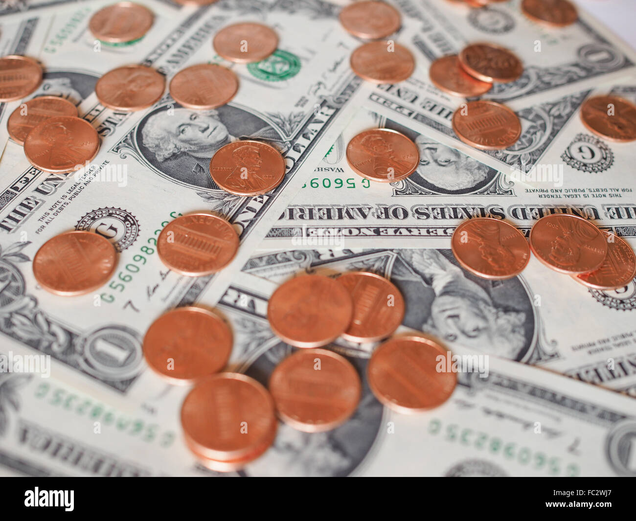 Dollar coins and notes Stock Photo - Alamy