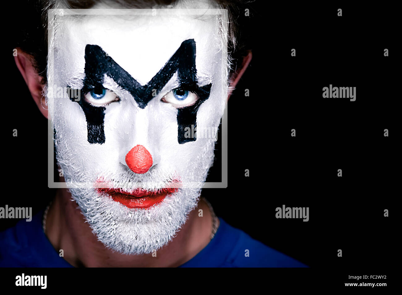 A man with clown makeup on his face Stock Photo - Alamy