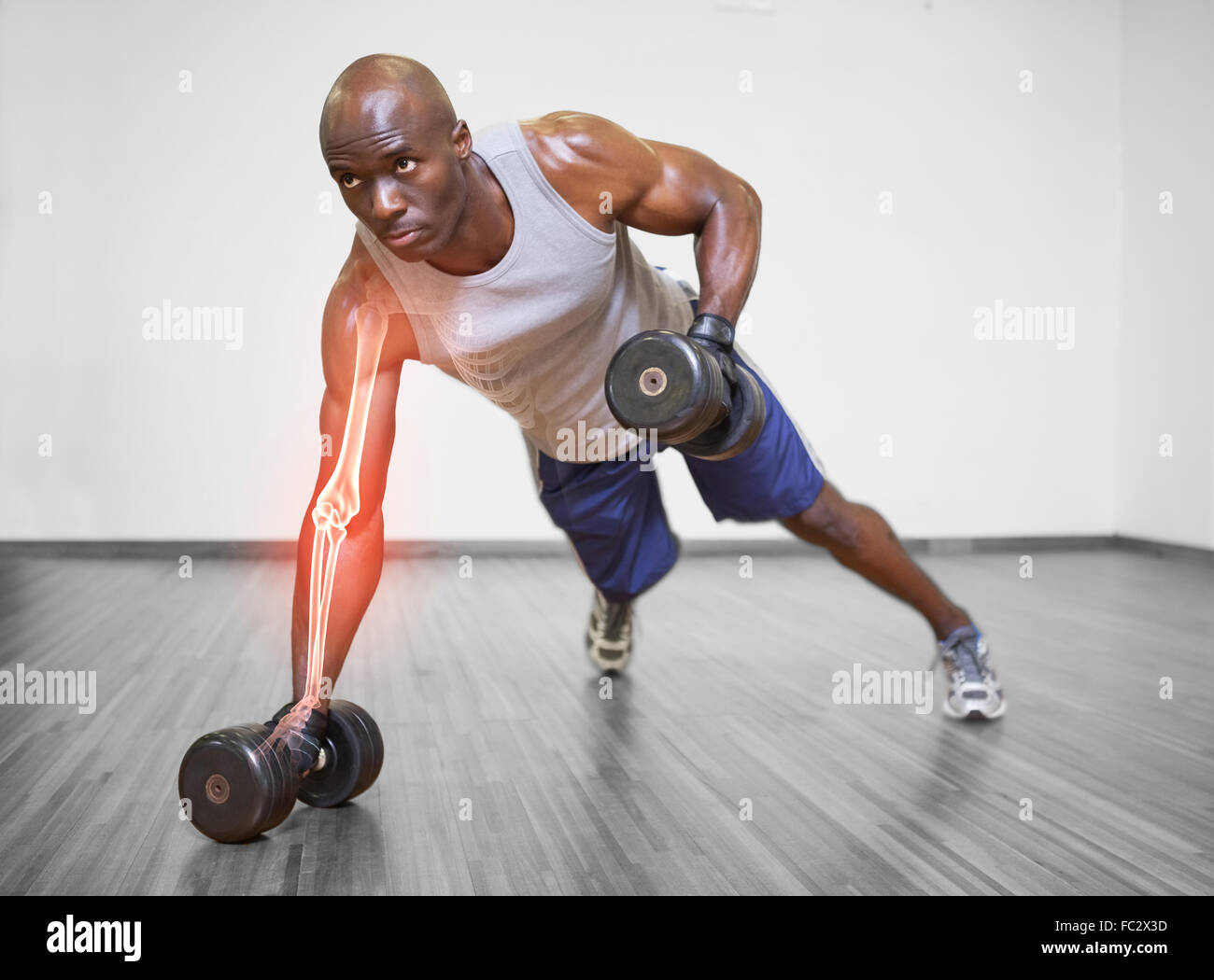 Highlighted arm of strong man lifting weights Stock Photo - Alamy