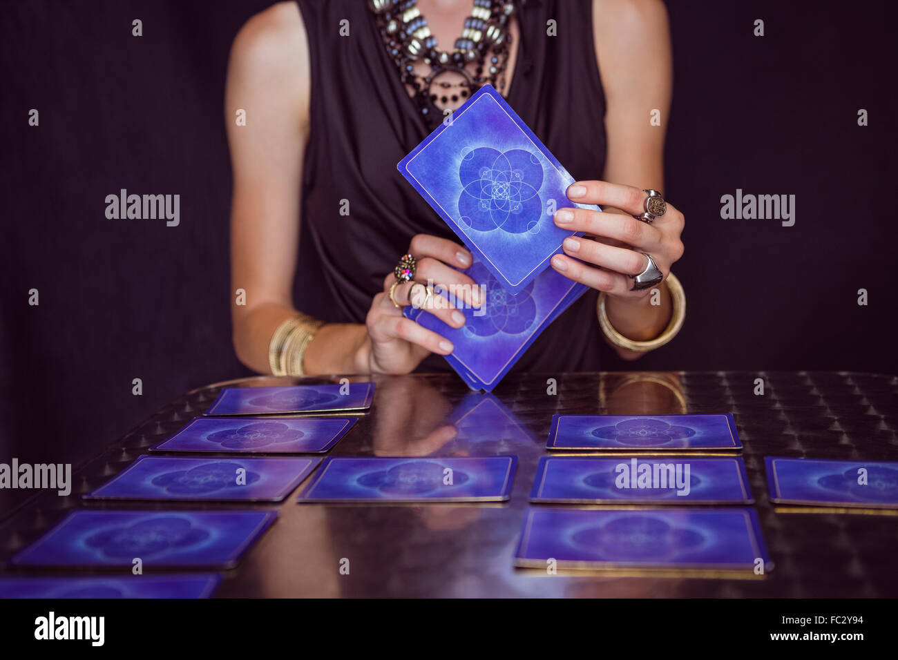 Fortune teller forecasting the future with tarot cards Stock Photo - Alamy