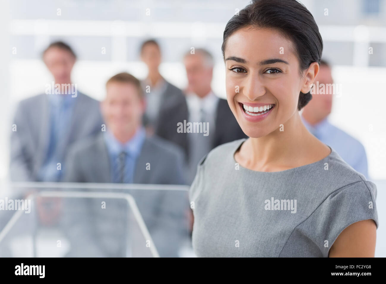 Smiling businesswoman looking at camera during conference Stock Photo ...