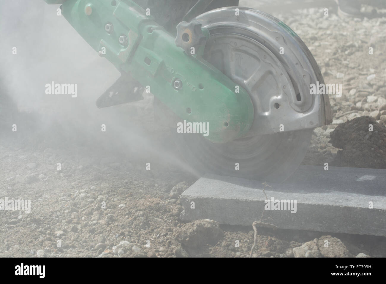 Dusty stone cutting Stock Photo - Alamy