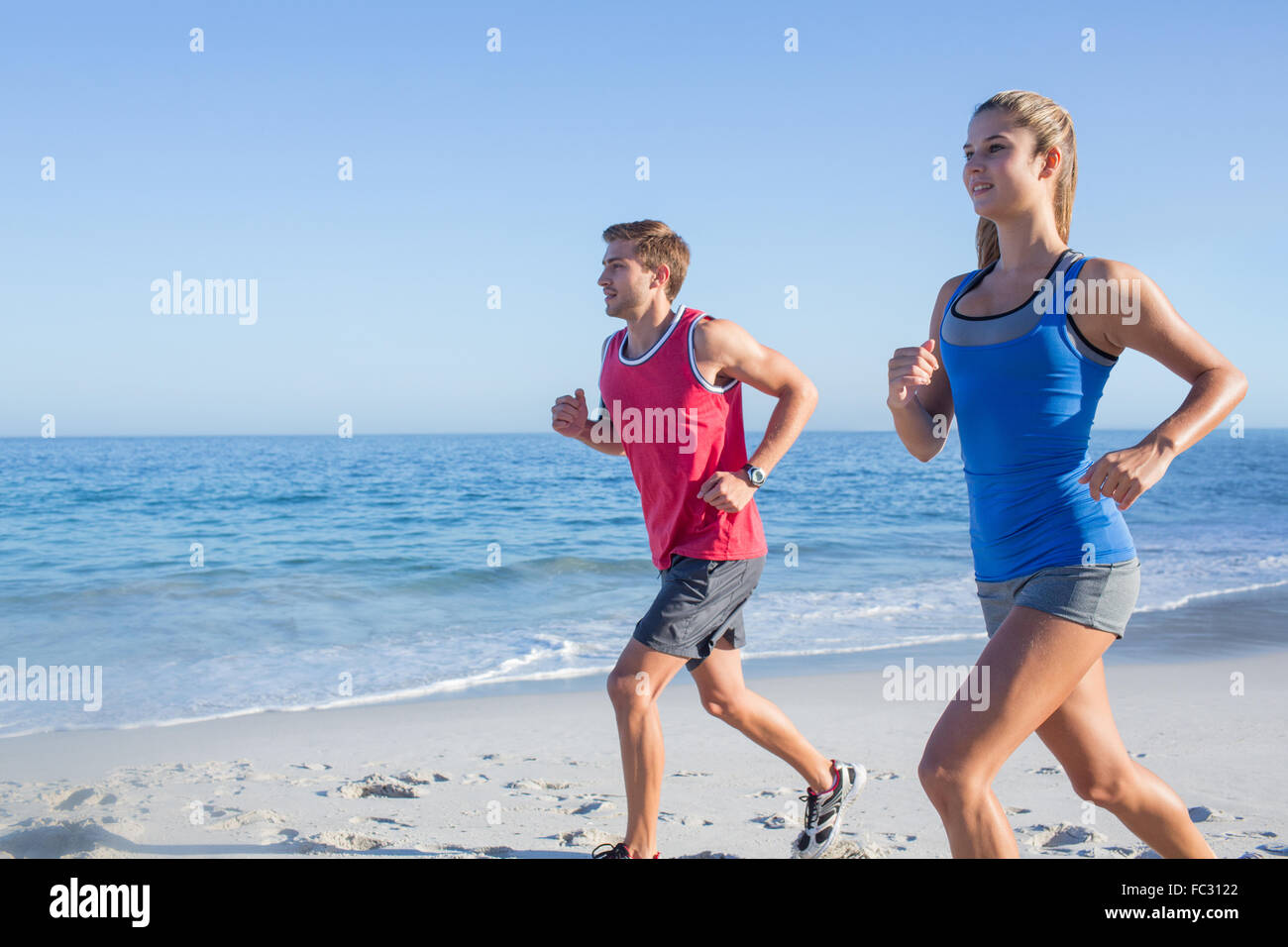 Smiling focused young pretty couple hi-res stock photography and images ...