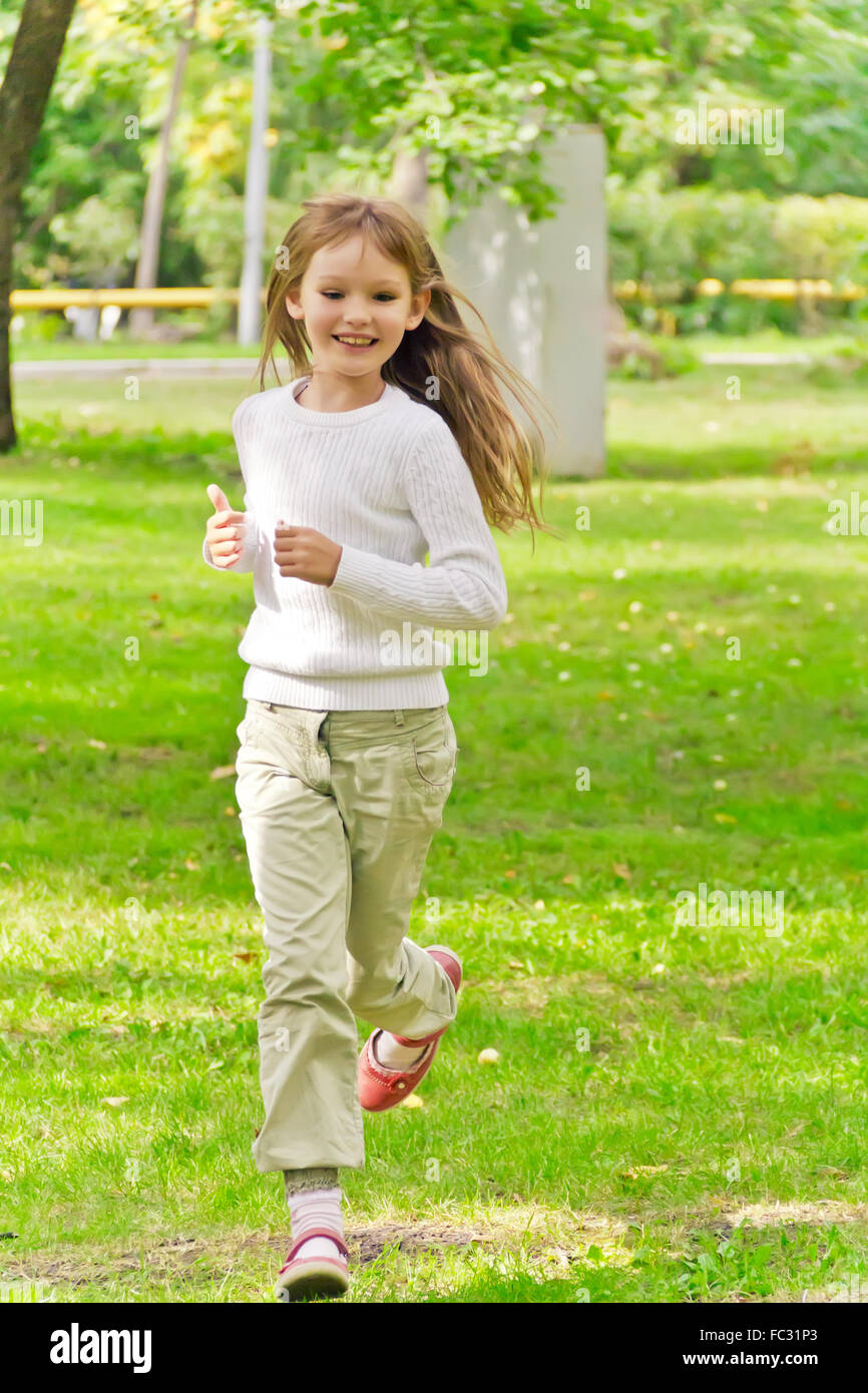 Cute running girl Stock Photo - Alamy