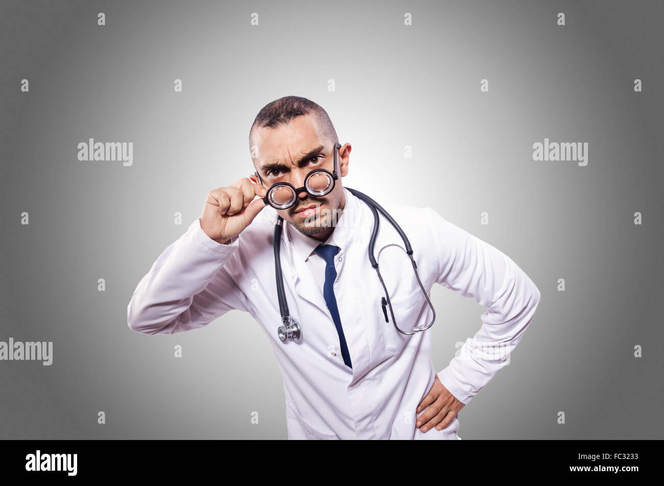 Funny doctor isolated on the white Stock Photo - Alamy