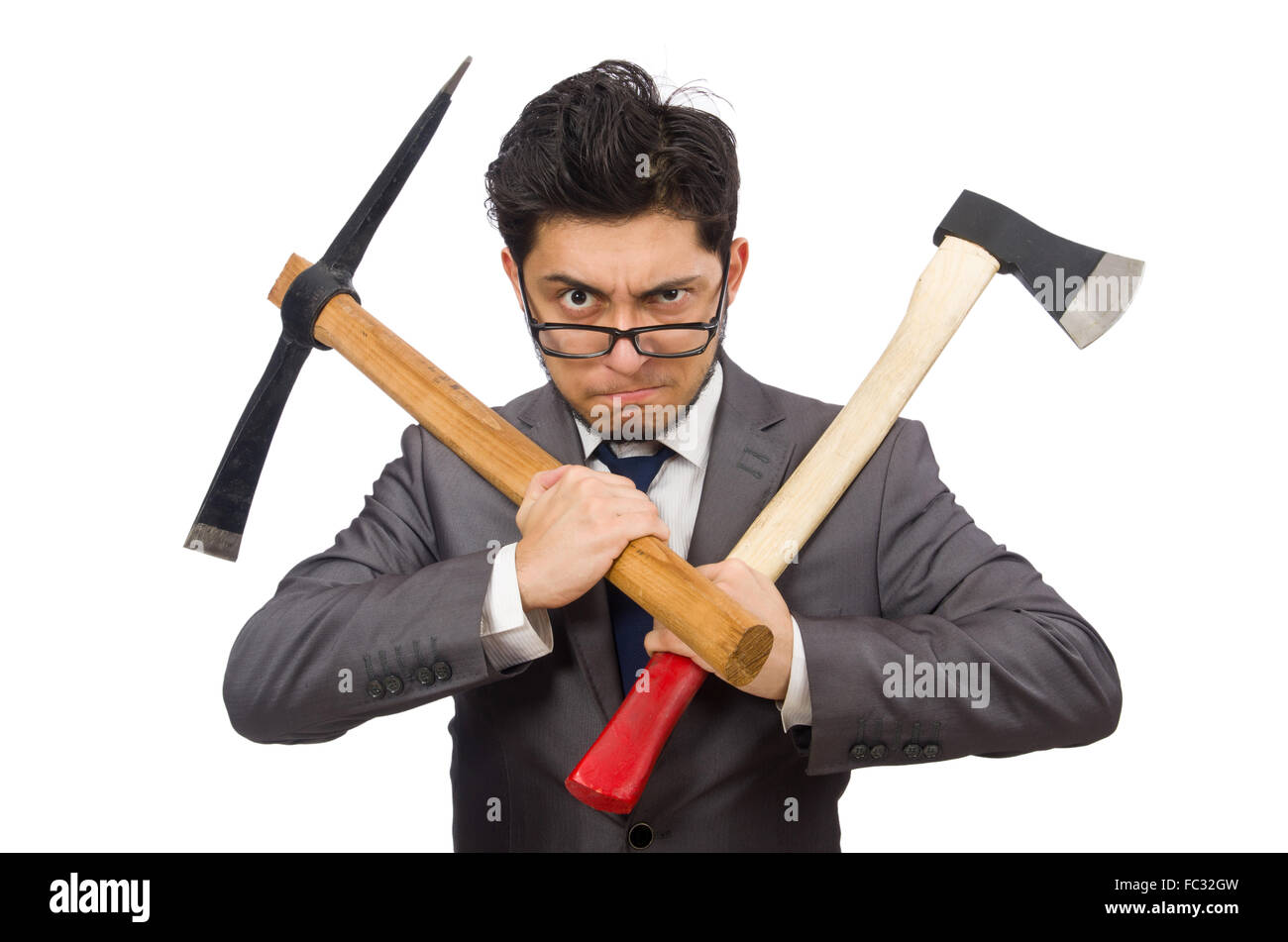 Young businessman holding a tool isolated on white Stock Photo - Alamy