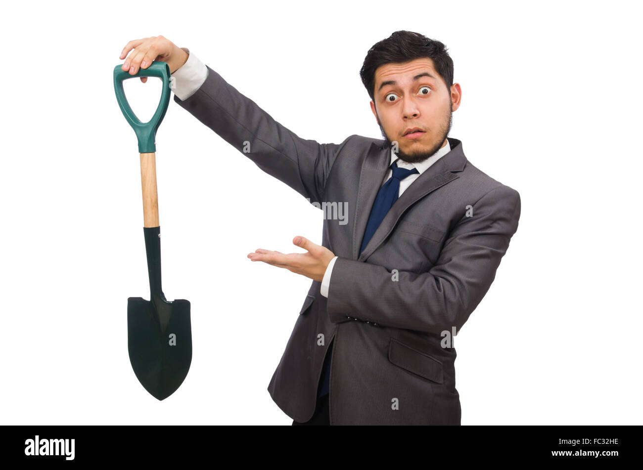 Young businessman holding a tool isolated on white Stock Photo - Alamy