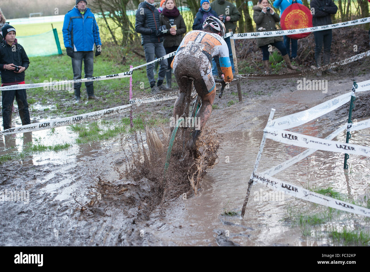 Cyclocross rider riding through water during a race Stock Photo - Alamy