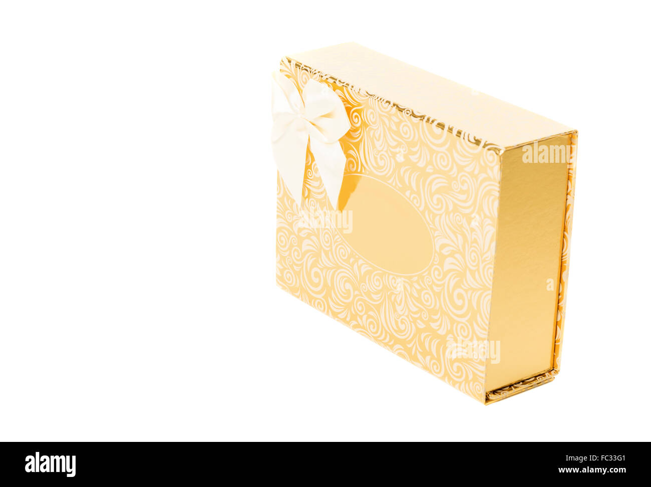 Golden gift box with bow tie side view Stock Photo - Alamy
