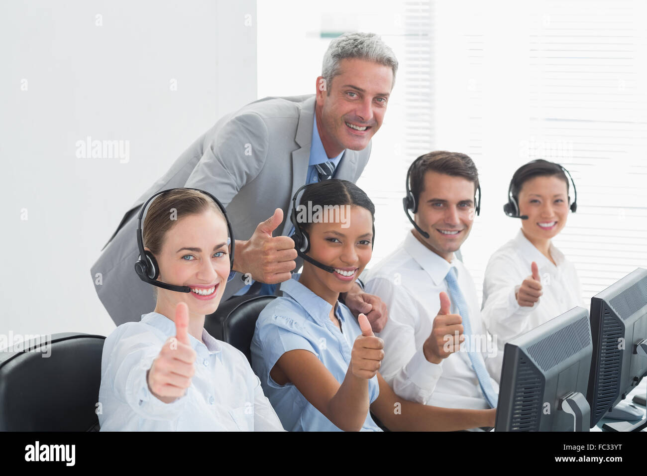 Thumbs up computers hi-res stock photography and images - Alamy