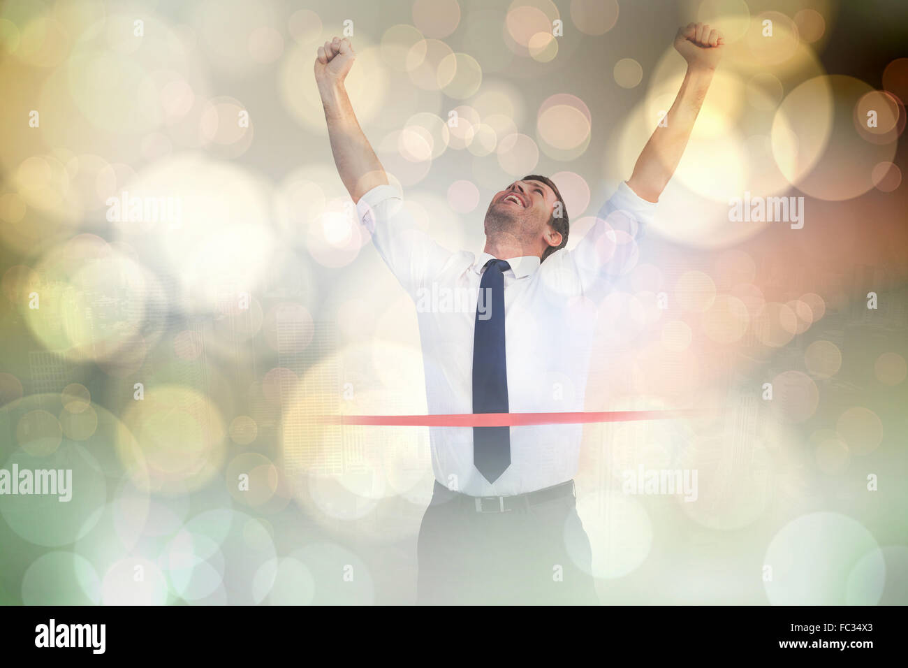 Composite image of businessman celebrating success with arms up Stock ...