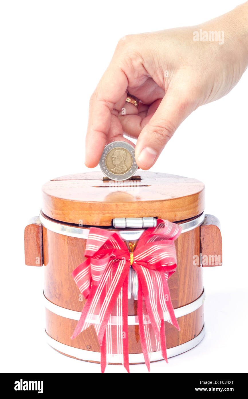 Putting coin to save money, stock photo Stock Photo - Alamy