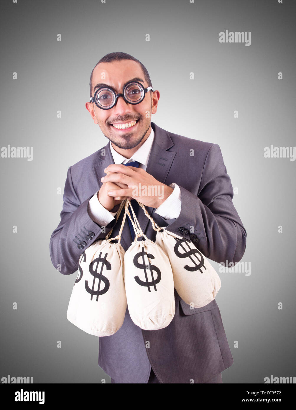Man with sacks of money on white Stock Photo - Alamy